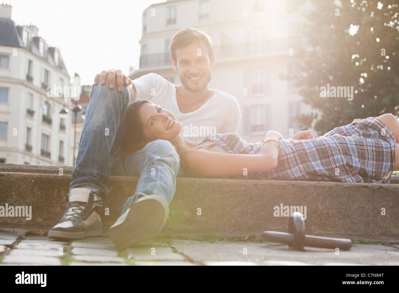 Young Woman Resting On Lap Of A Young Man High Resolution Stock ...