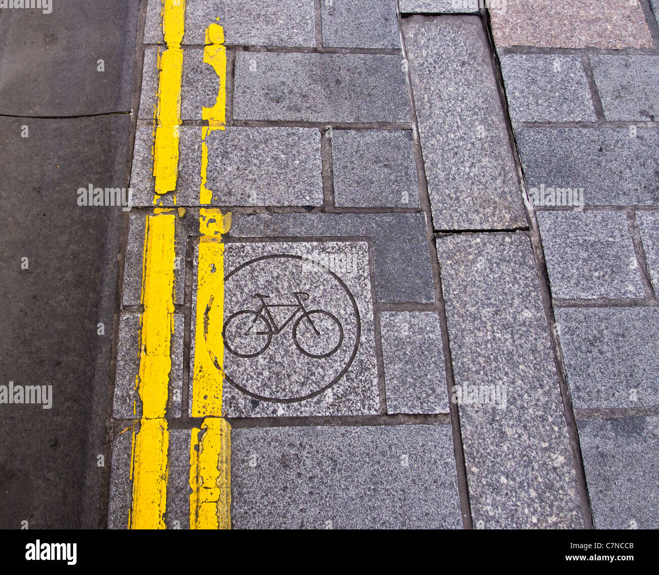 Bicycle sign set into pavement, Queen's Square, Northern Ireland Stock ...