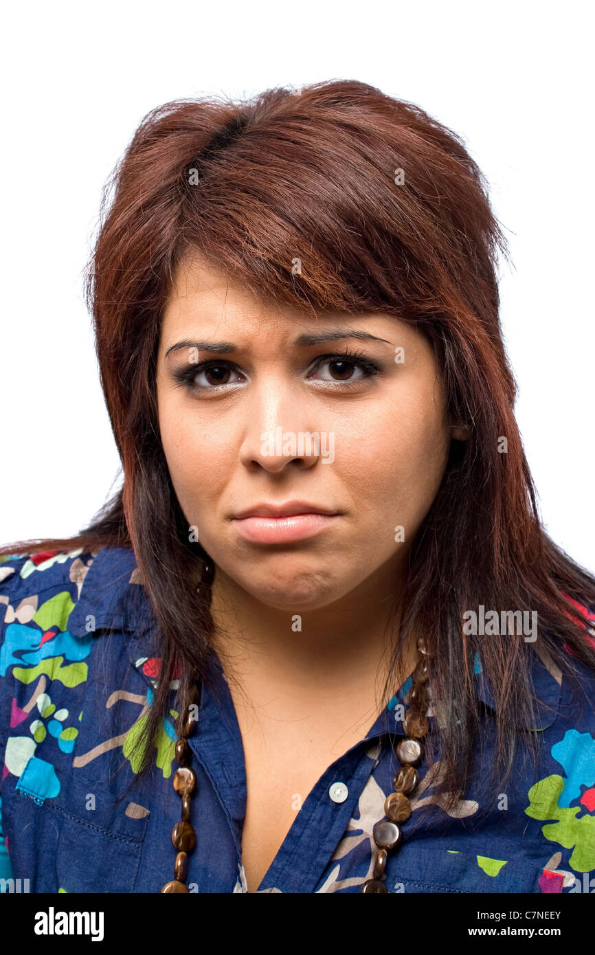 A pretty young hispanic woman isolated over a white background with a ...