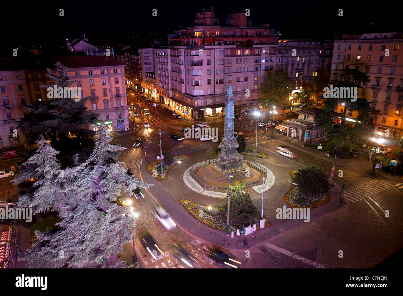 View of an Italian square at night with cars and traffic: Piazza Cinque ...