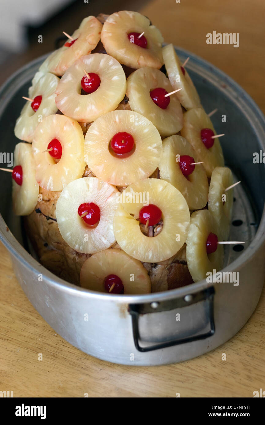 A large 12 pound ham all garnished prepared and ready to bake in the ...