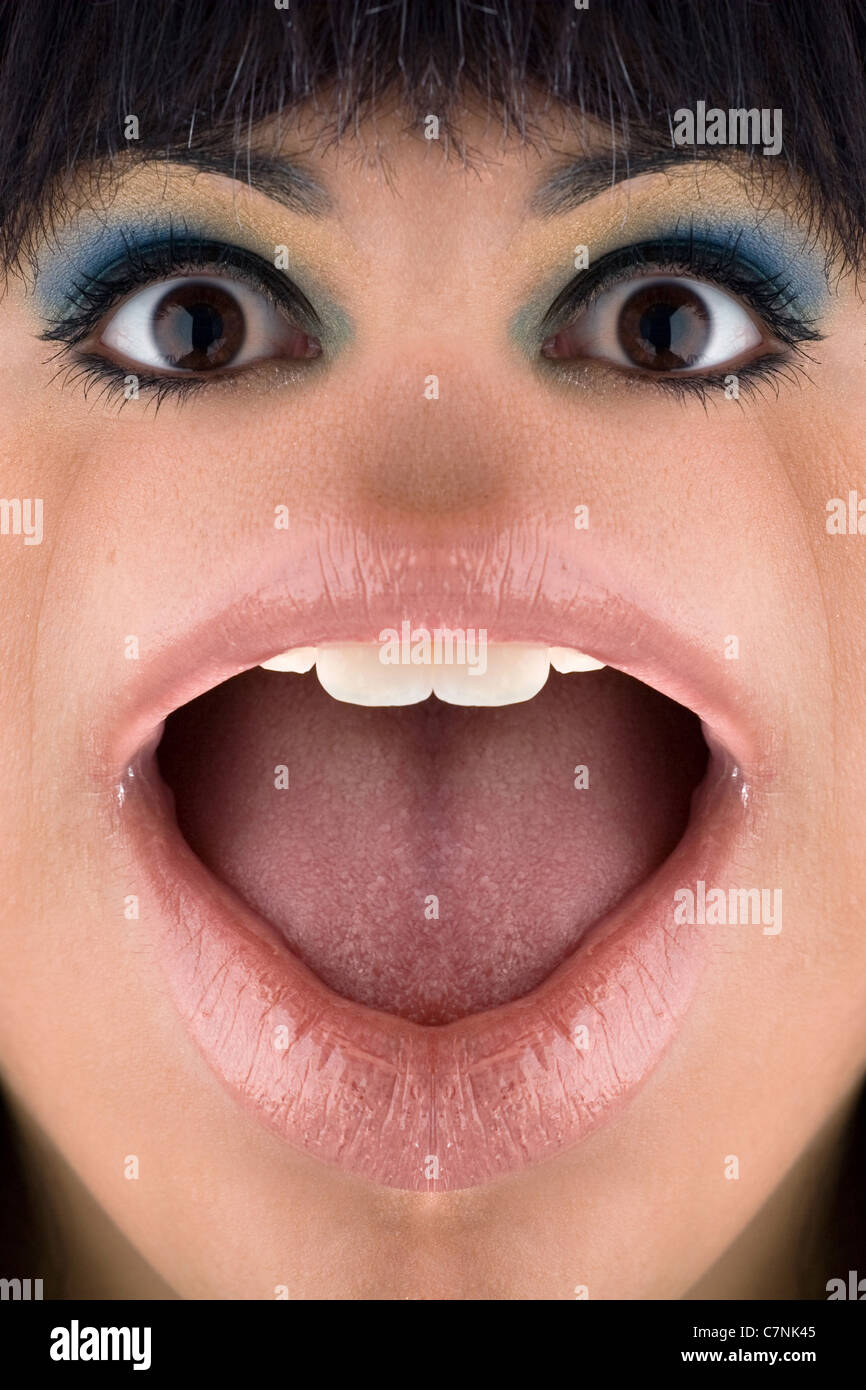 A closeup of a distorted womans face that makes her look like a frog ...