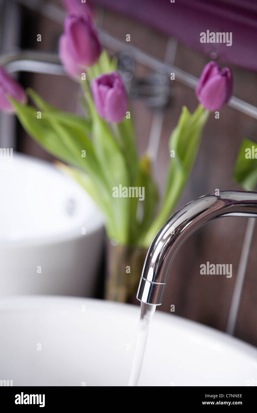 Water running into basin from a mixer tap Stock Photo - Alamy