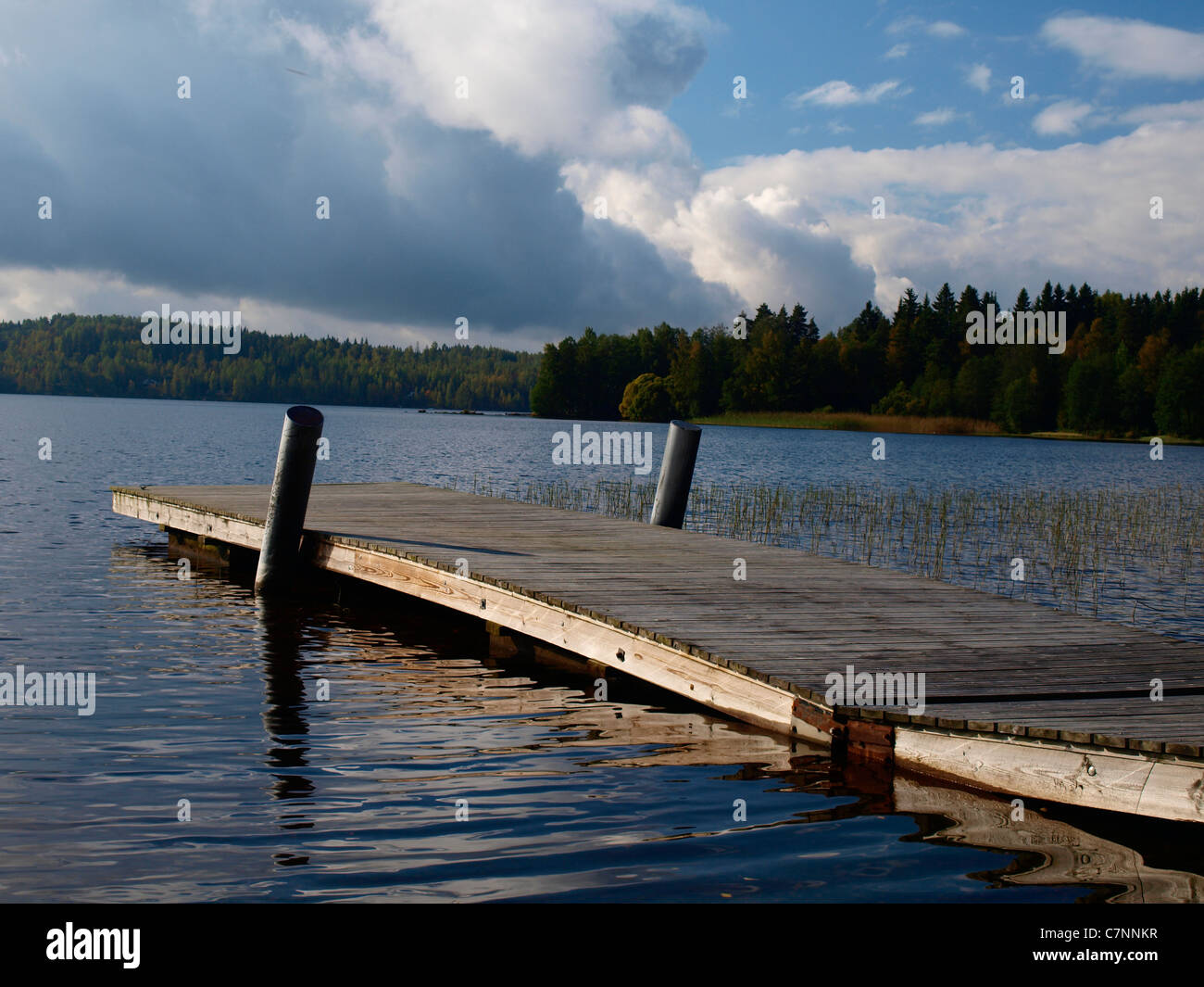 Pier into blue water hi-res stock photography and images - Alamy