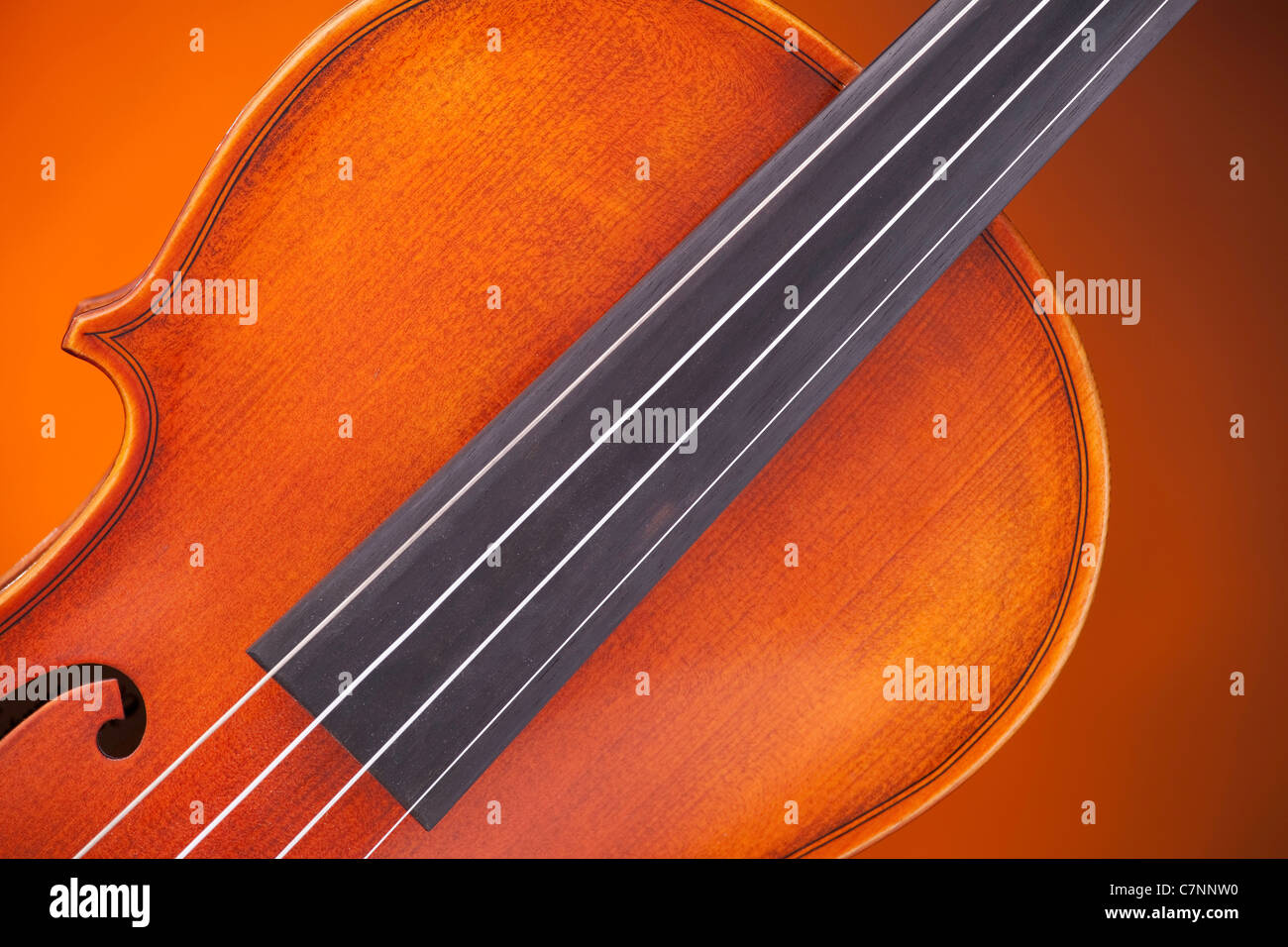 An antique violin viola isolated against a gold background Stock Photo ...