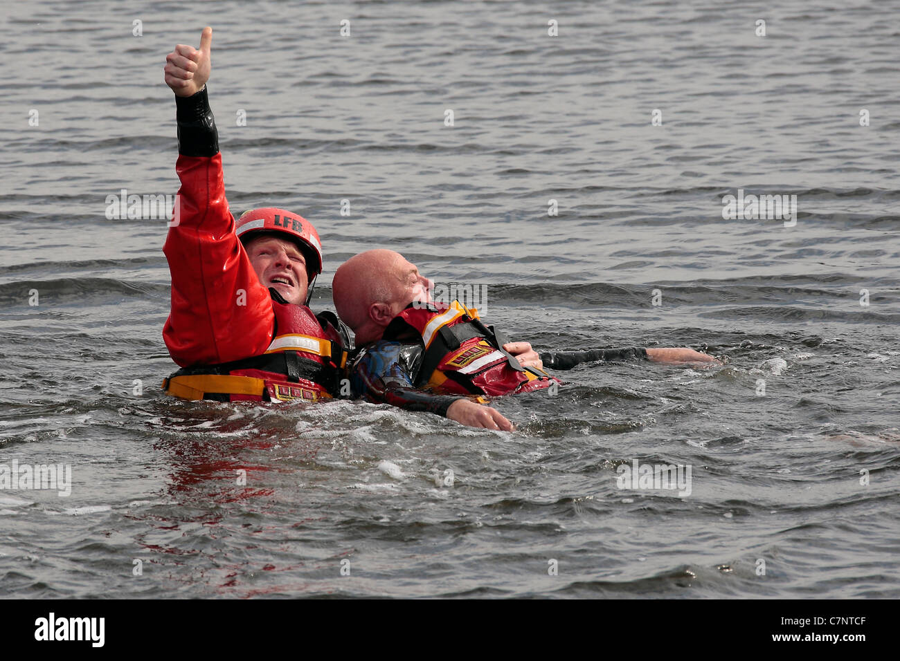Firefighter rescue a simulated casualty from the River Thames in London ...