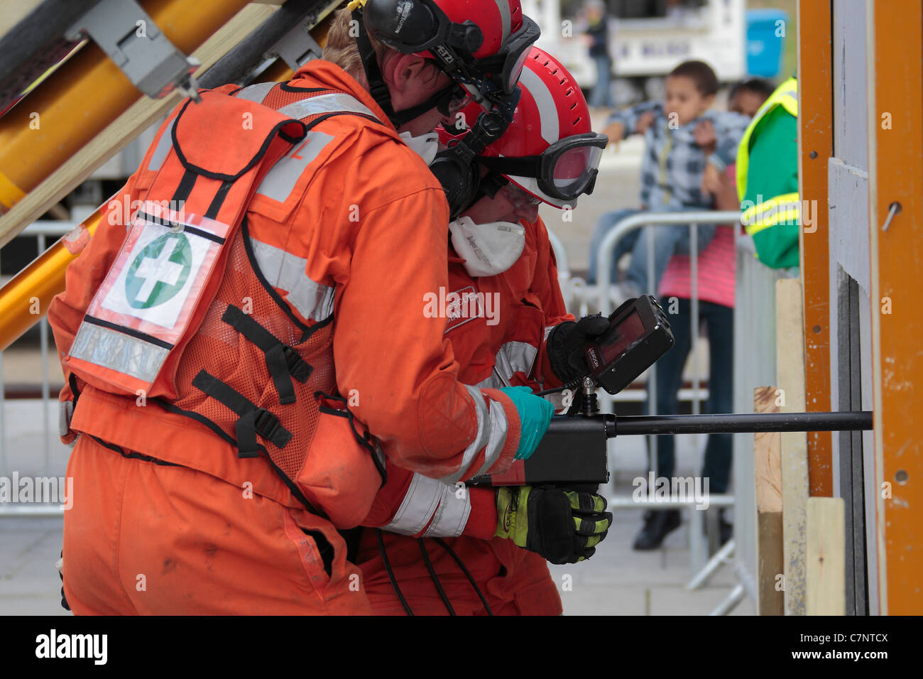 Firefighters using a Search Camera to look inside a confined space ...