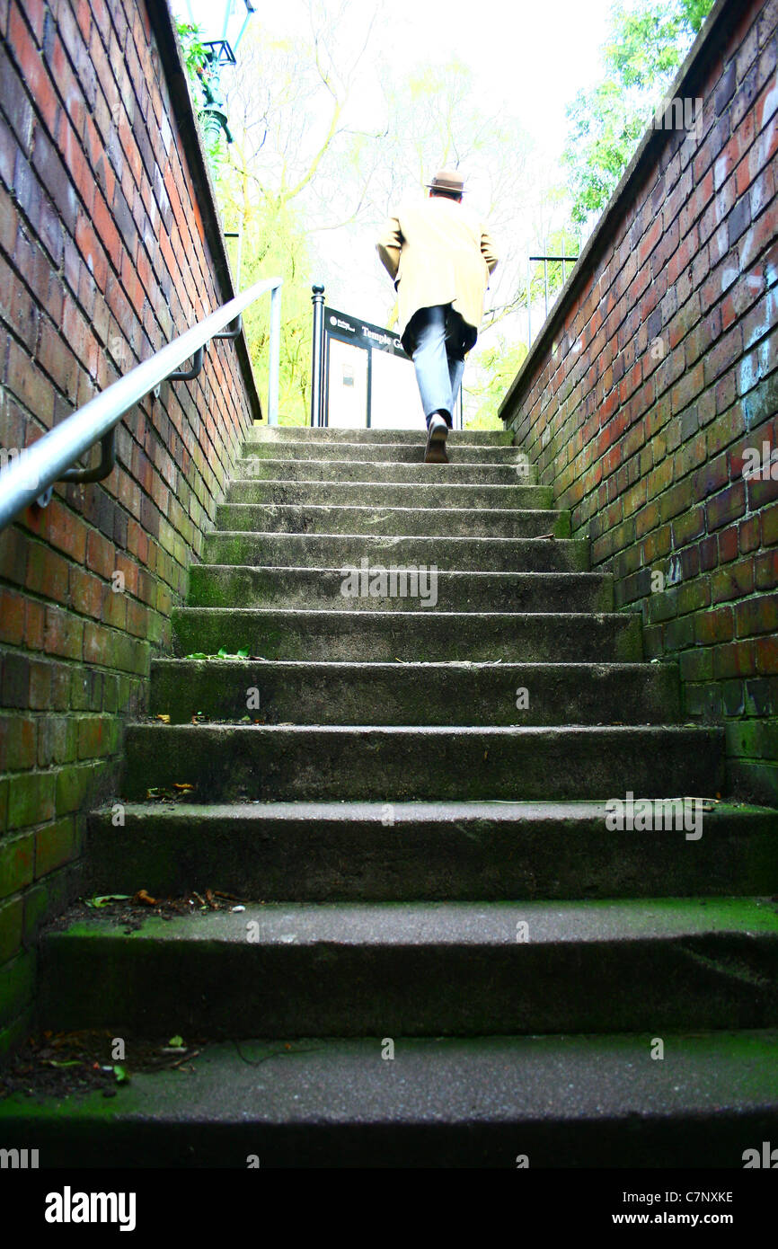 A man walking up steps Stock Photo - Alamy