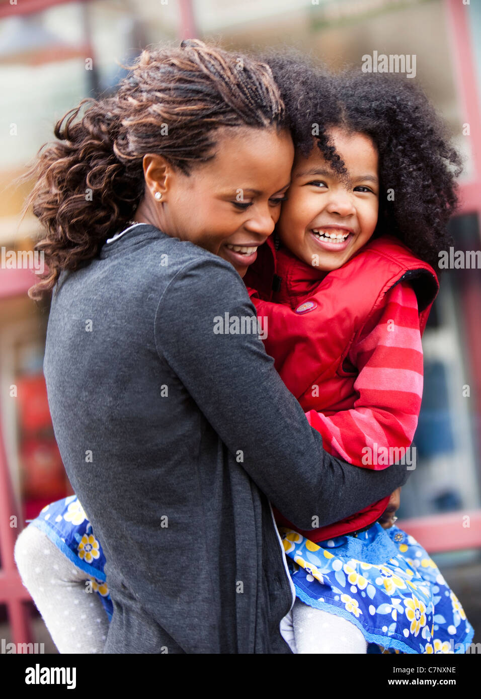 african american mom hug daughter Stock Photo - Alamy