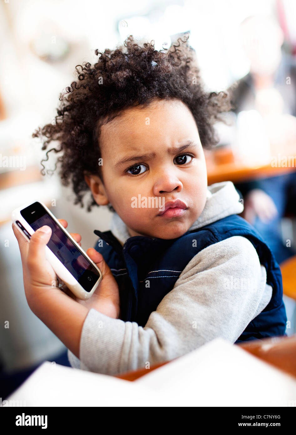 Child using iphone hi-res stock photography and images - Alamy