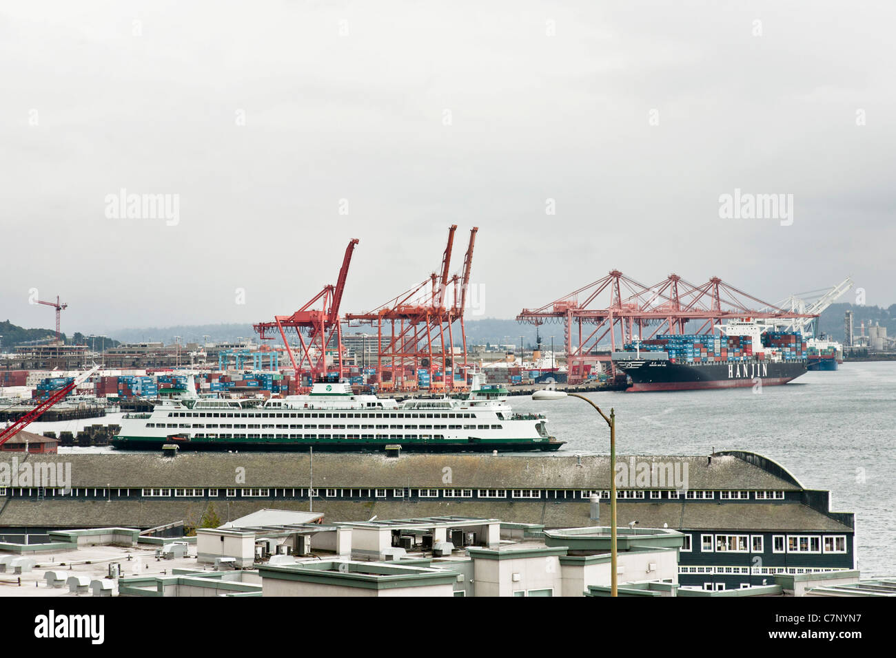 Washington State ferry in Seattle waterfront slip against backdrop of ...