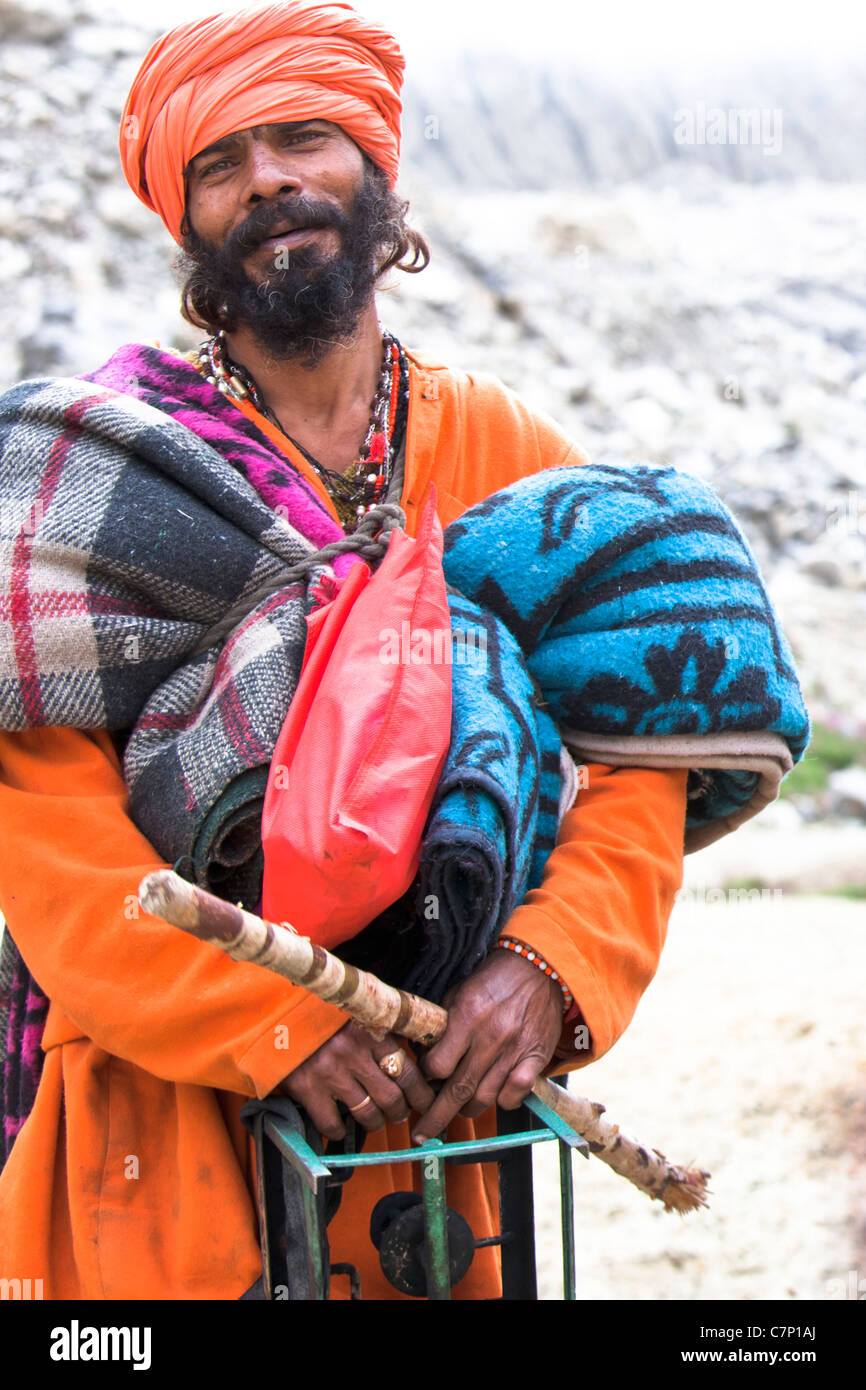 A Indian Sadhu (Sage) wearing bright robes at the Gangotri Glacier ...