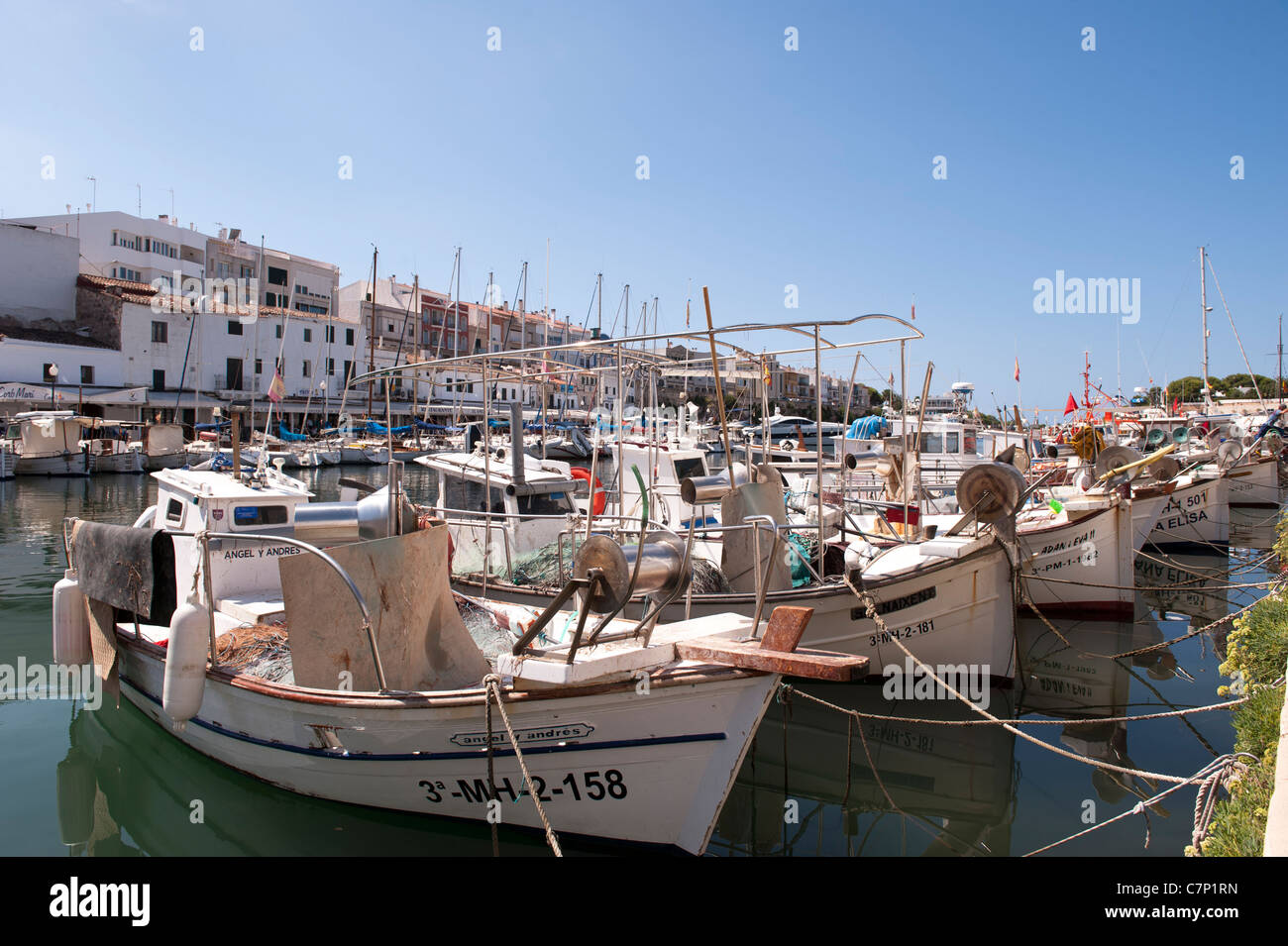 Fishing boats docked in the port on Menorca / Minorca Island Stock ...