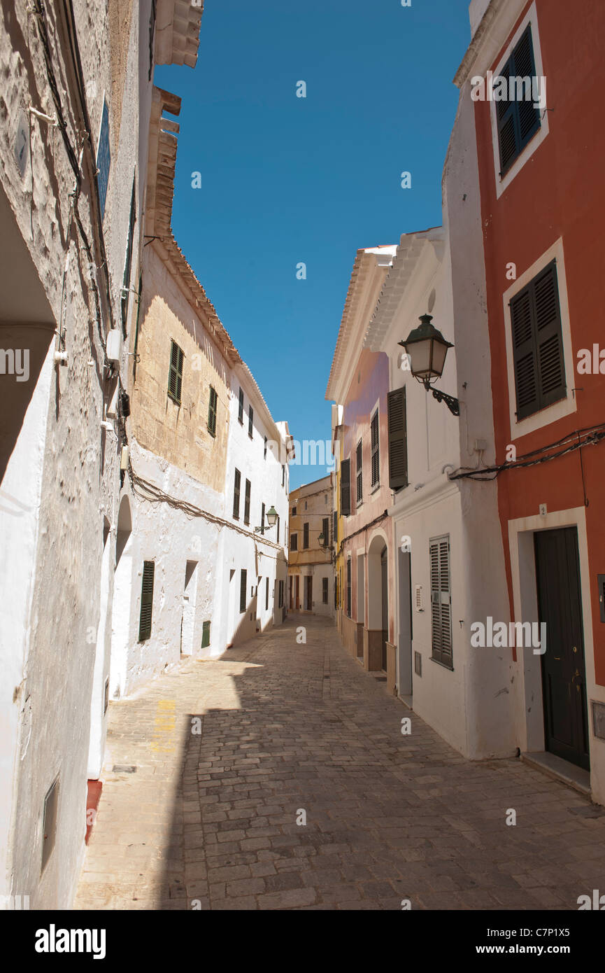 Ciutadella Street Alley in Minorca Spain, bright coloured building line a street Stock Photo - Alamy