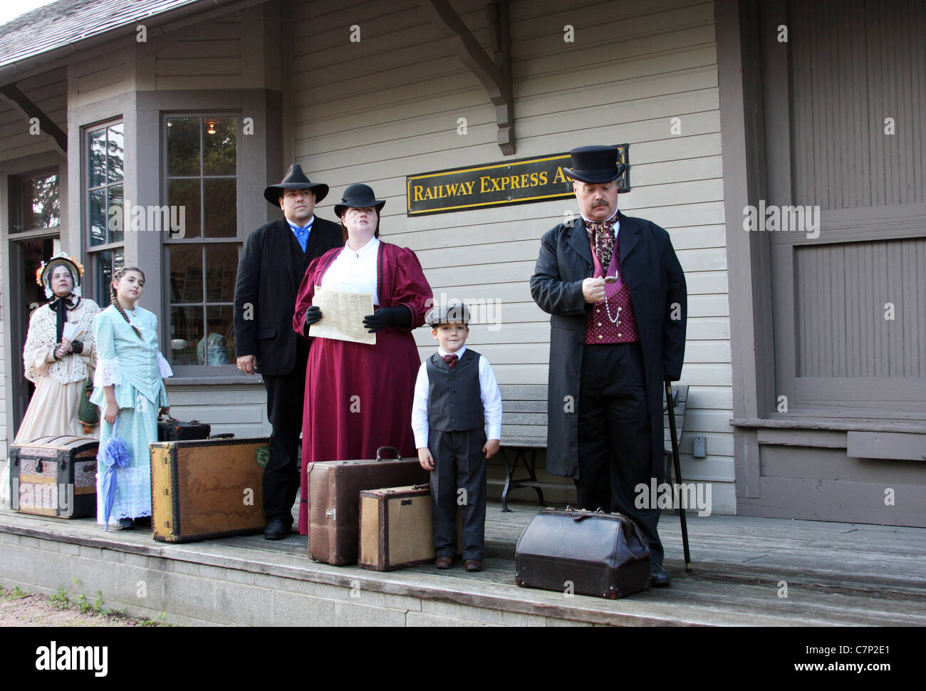 Travelers waiting for a train on the depot platform Stock Photo - Alamy