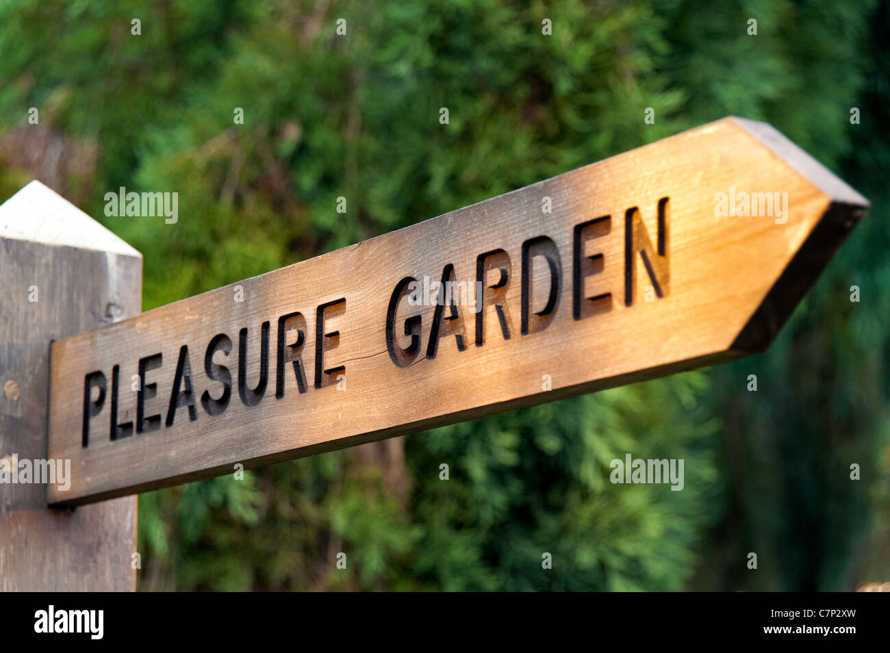 Wooden sign in public park reading pleasure garden Stock Photo - Alamy
