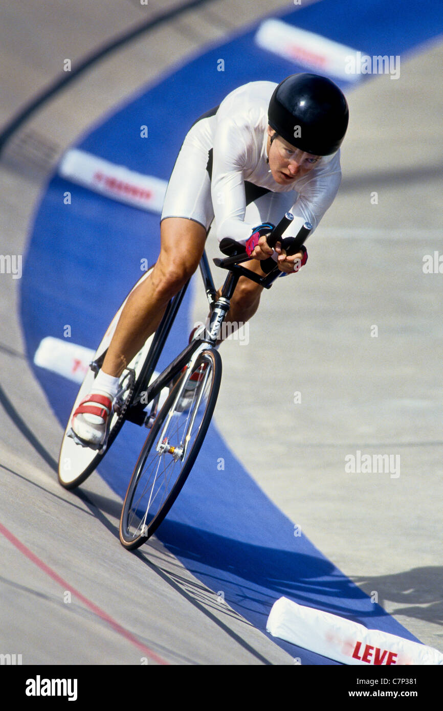 Female cyclist racing on the velodrome track Stock Photo - Alamy