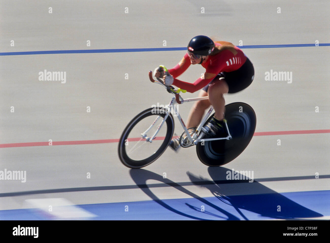 Female cyclist racing on the velodrome track Stock Photo - Alamy