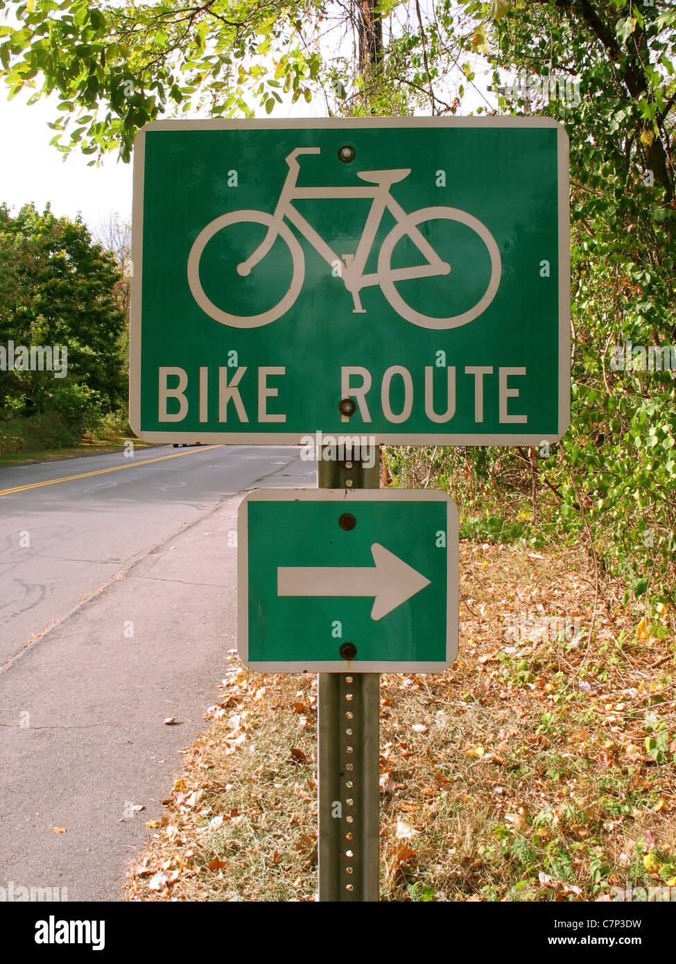 A green bike route sign on the side of the path Stock Photo - Alamy