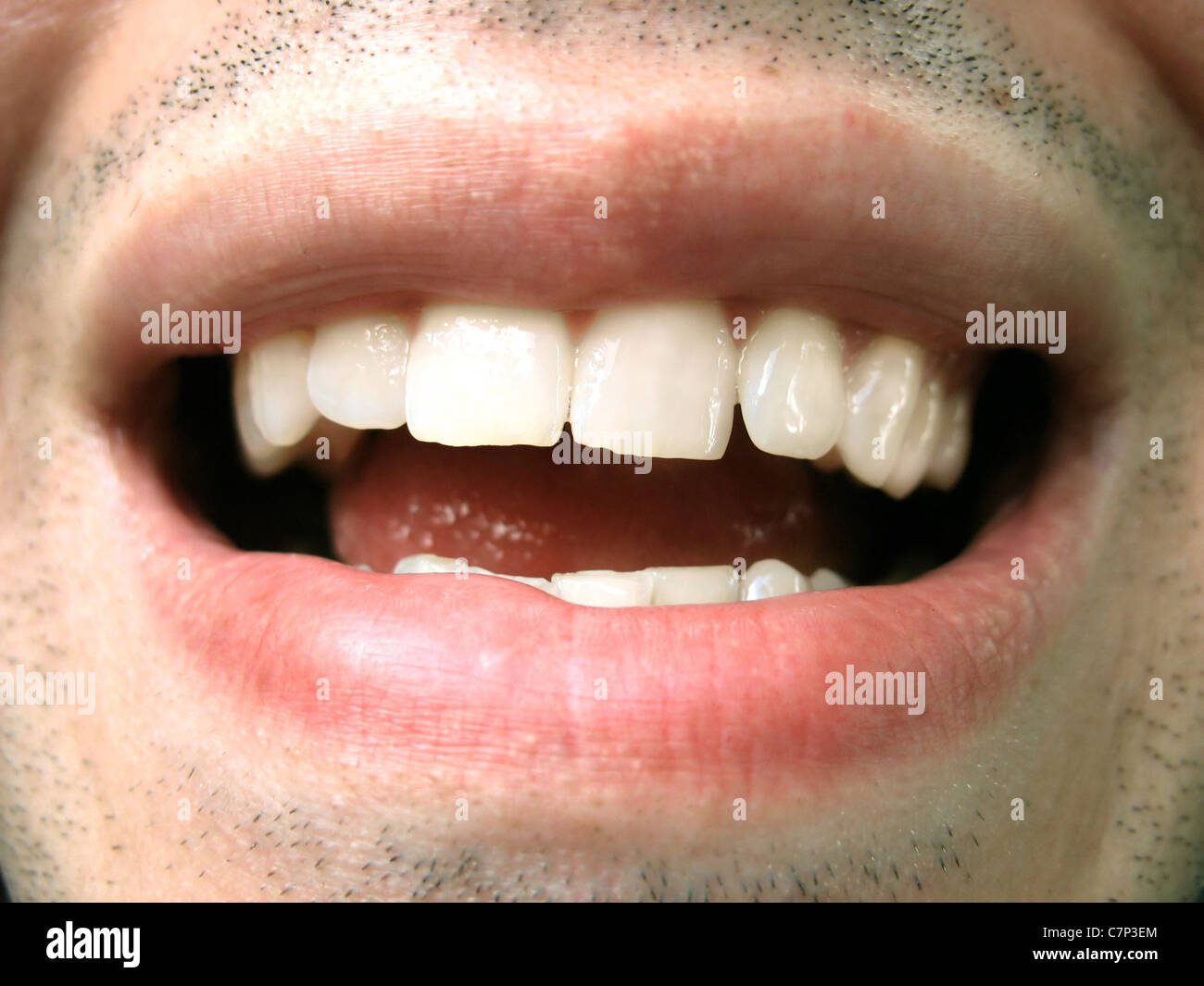 An extreme closeup of a young main smiling Stock Photo - Alamy