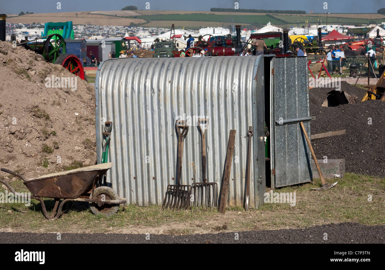 workmans steel hut with road working tools and wheelbarrow Stock Photo ...