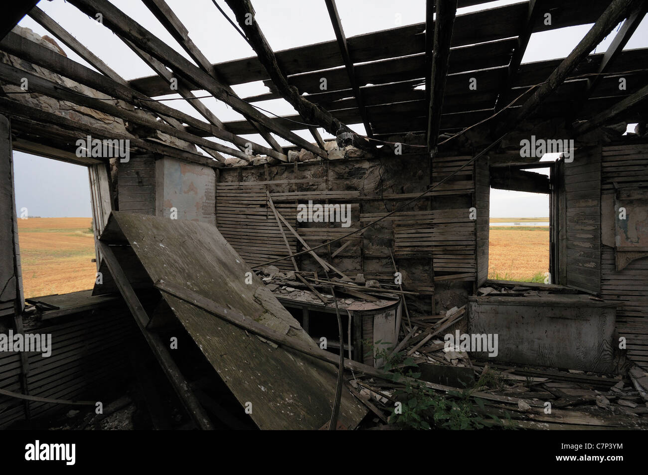 Inside of an old abandoned homestead in the middle of a field ...