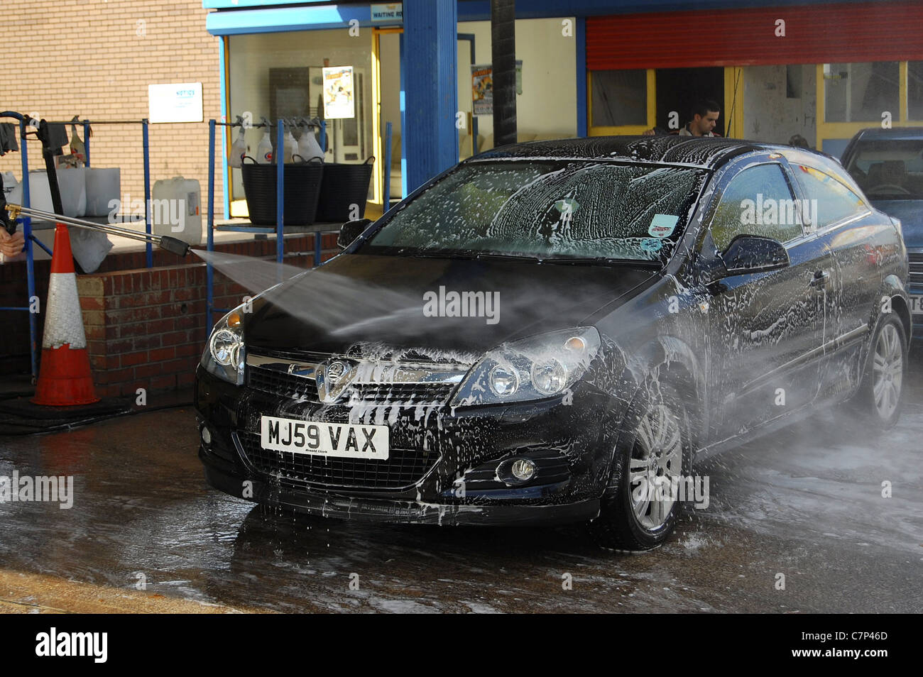Workers high pressure water cleaning hi-res stock photography and ...