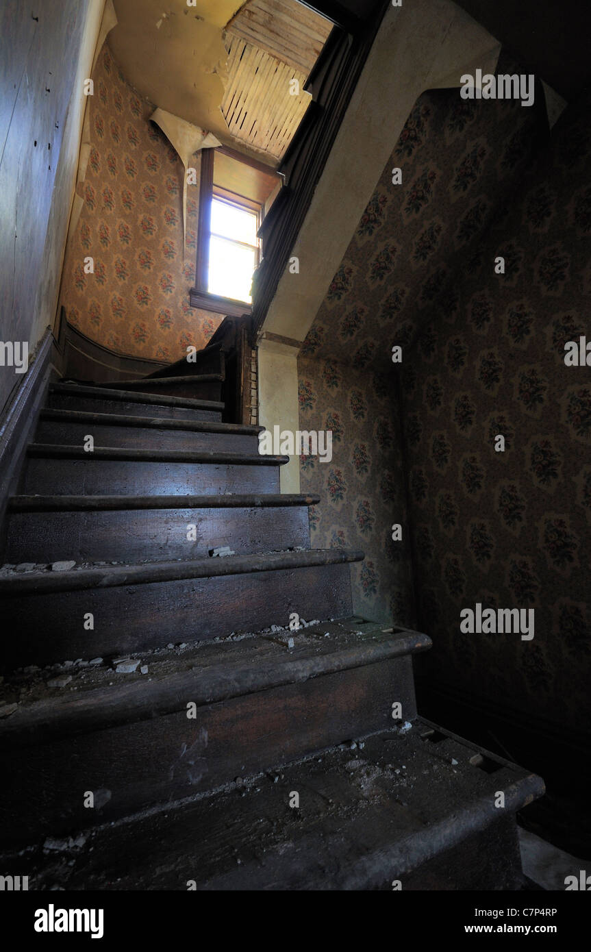 Inside of an old abandoned farm house in the middle of a field ...