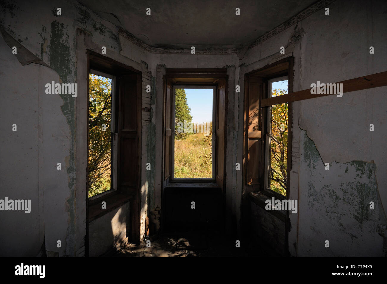 Inside of an old abandoned farm house in the middle of a field ...