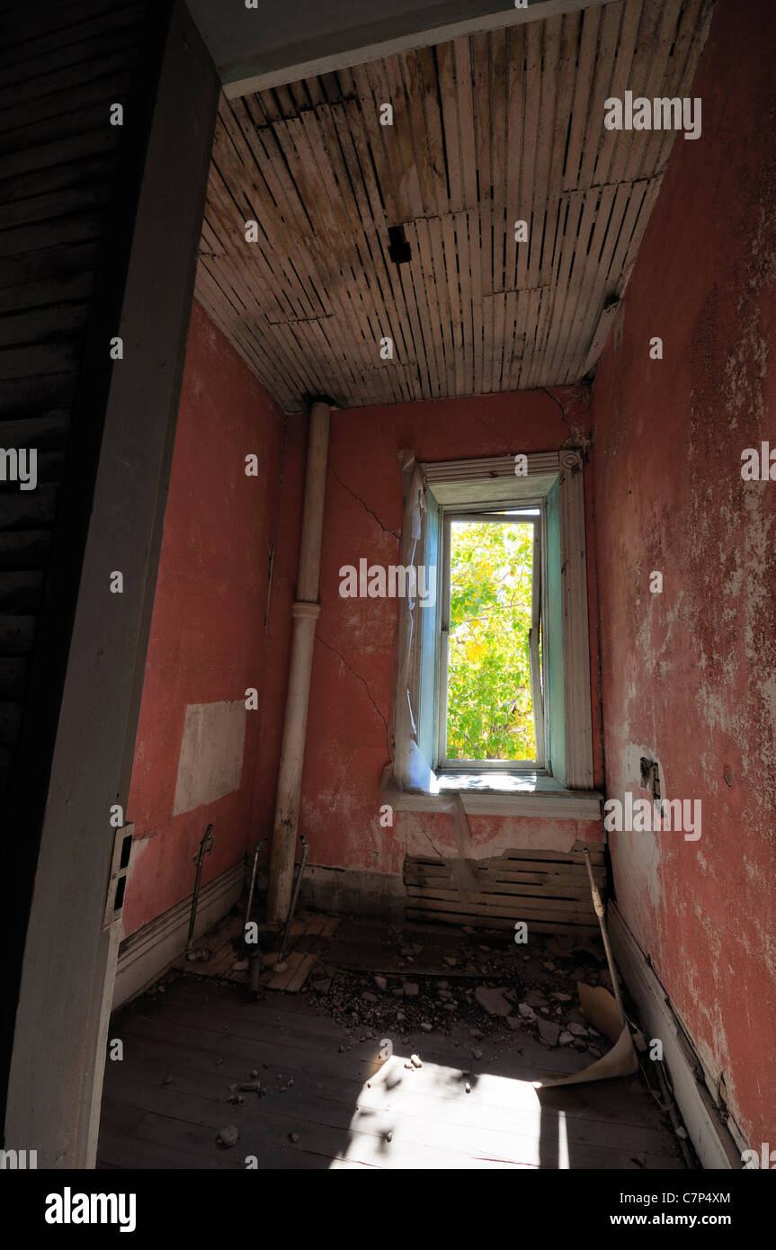 Inside of an old abandoned farm house in the middle of a field ...