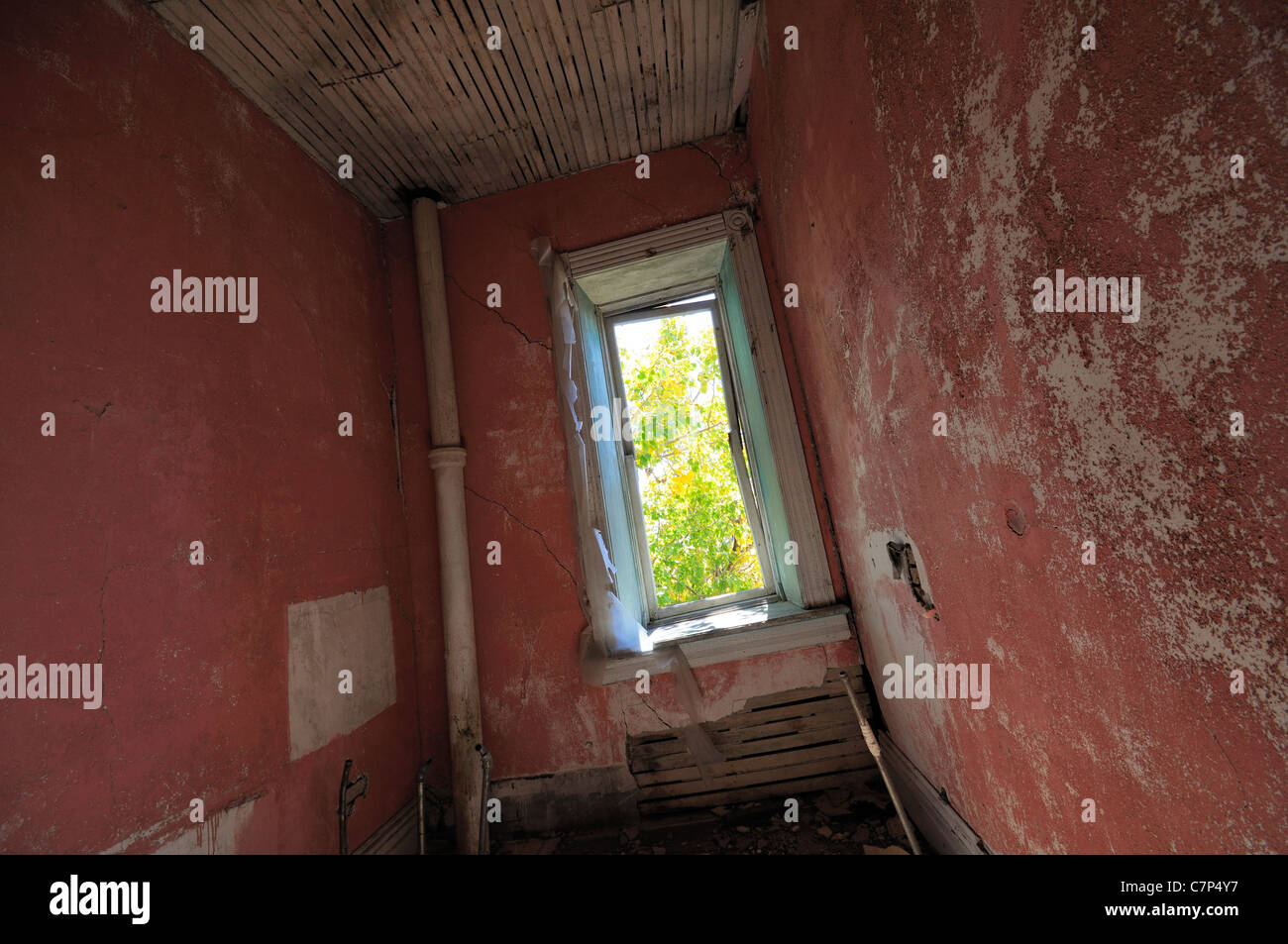 Inside of an old abandoned farm house in the middle of a field ...