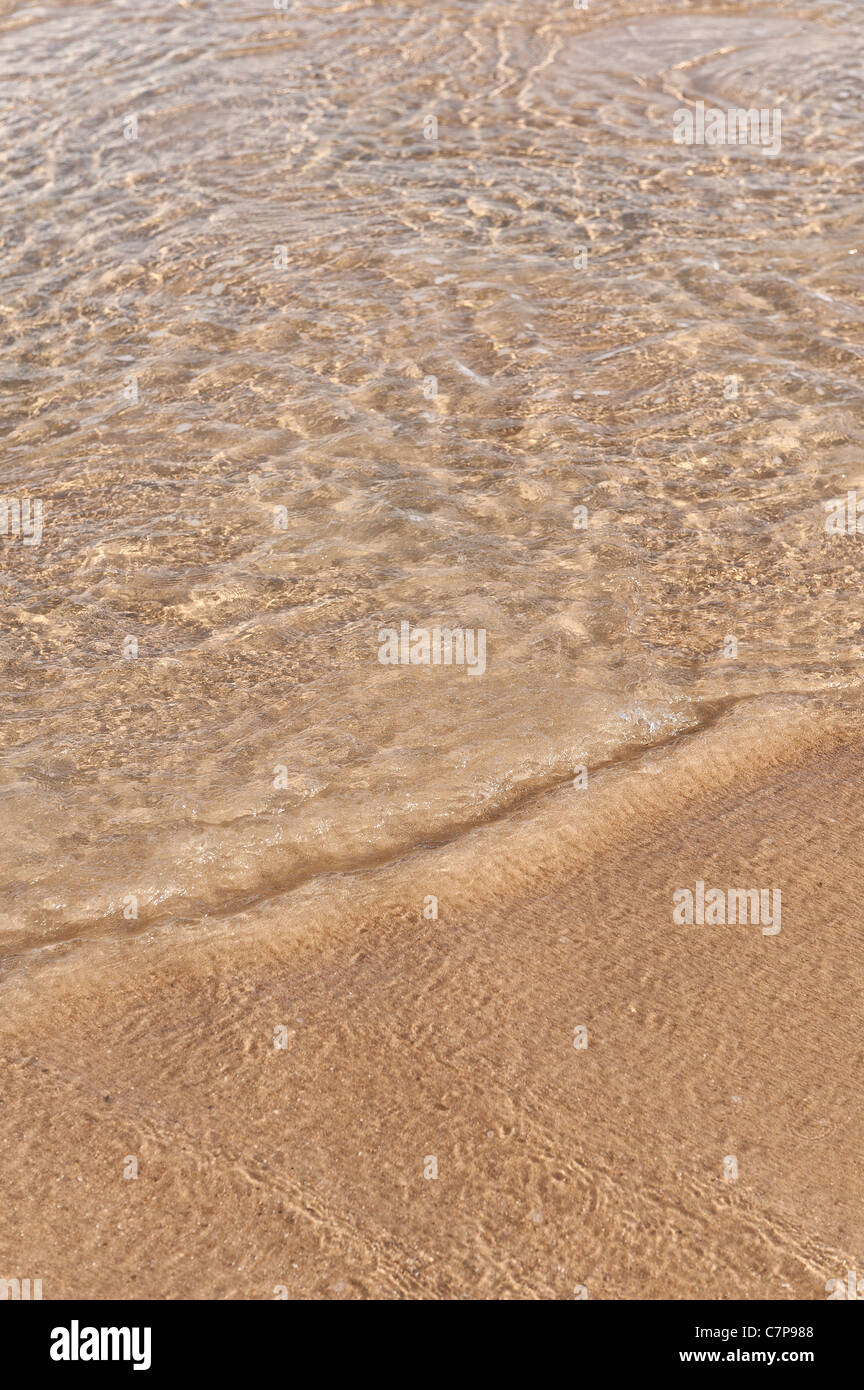 ripples reflections refraction wave patterns in shallow sea water on a ...