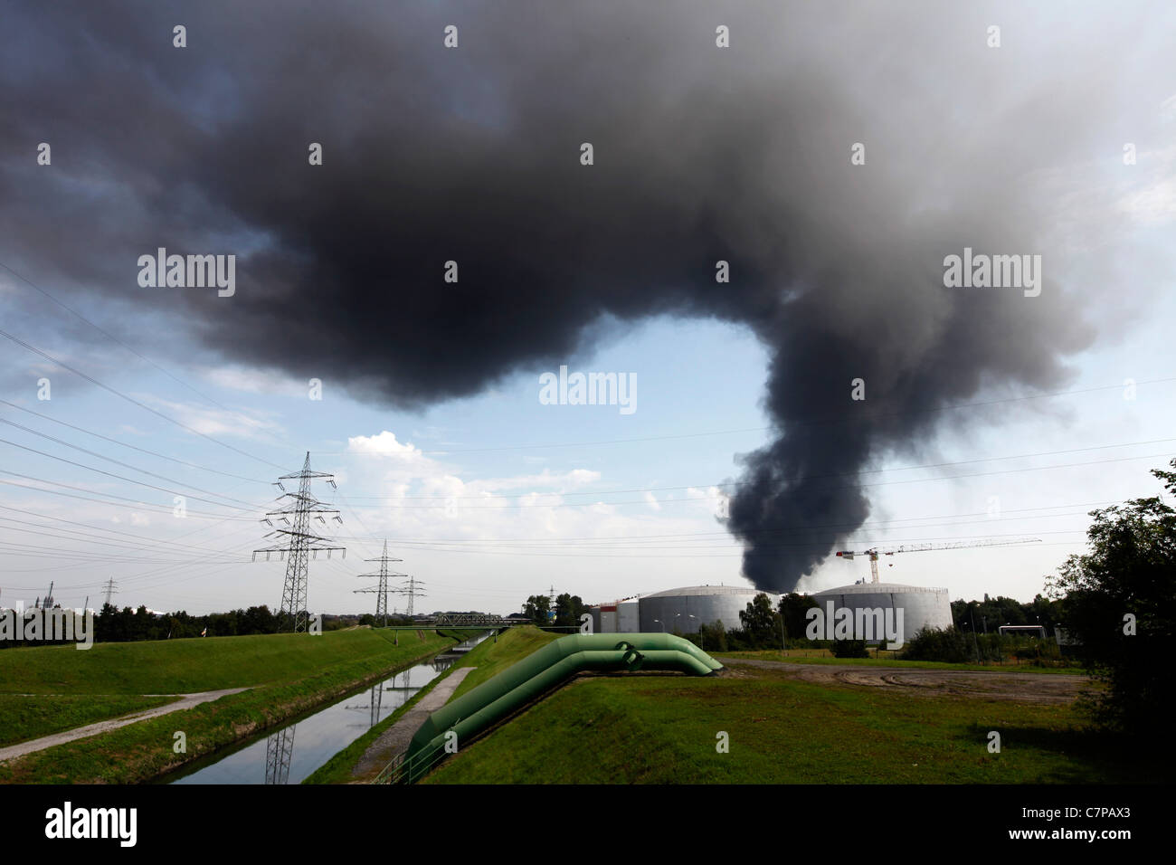 Big fire in an industrial area. A warehouse was burning, thick black ...