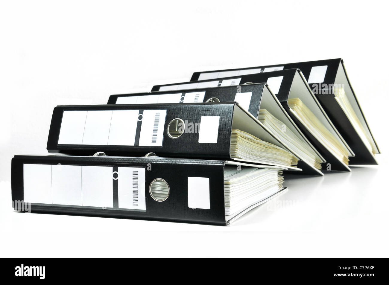 Various black colored office binders with important documents on white ...