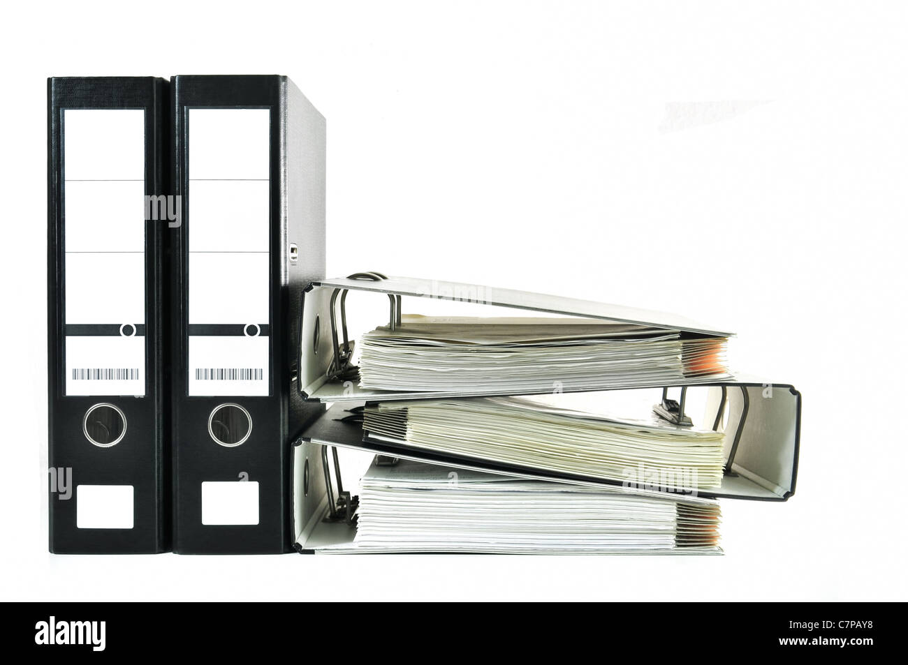 Various black colored office binders with important documents on white ...