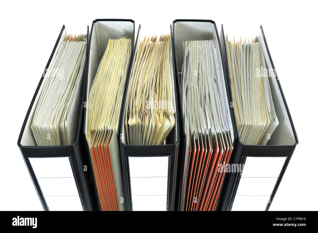Various black colored office binders with important documents on white ...