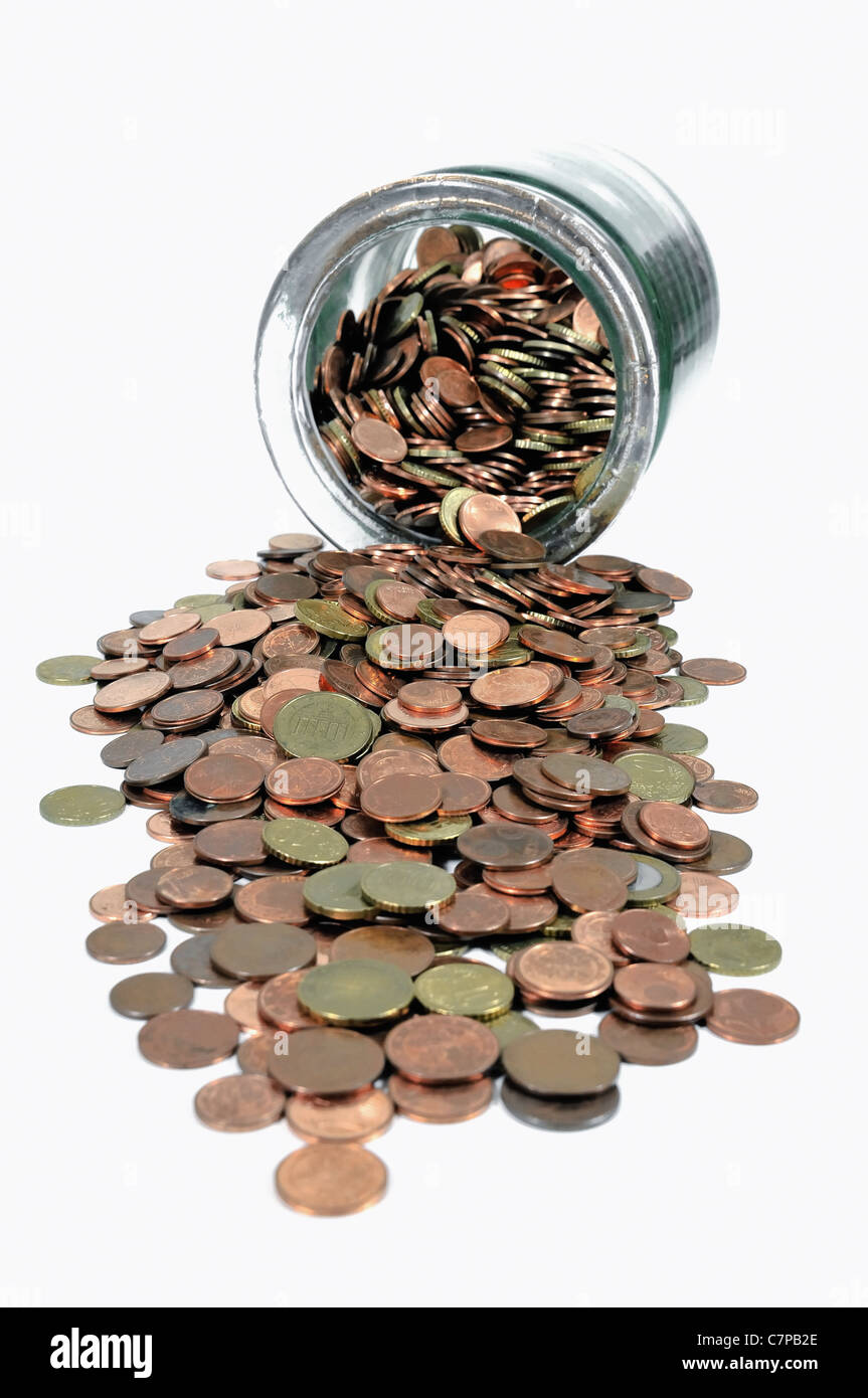 Glass money jar with spilling Euro cent coins on white background Stock ...