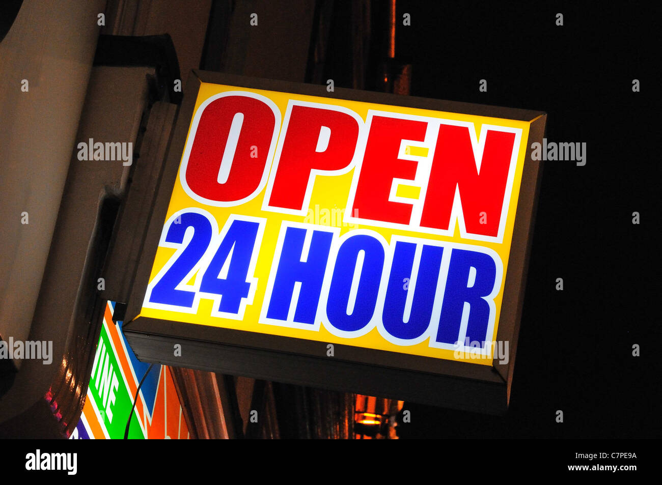 Close up 'Open 24Hour' sign at night Stock Photo - Alamy