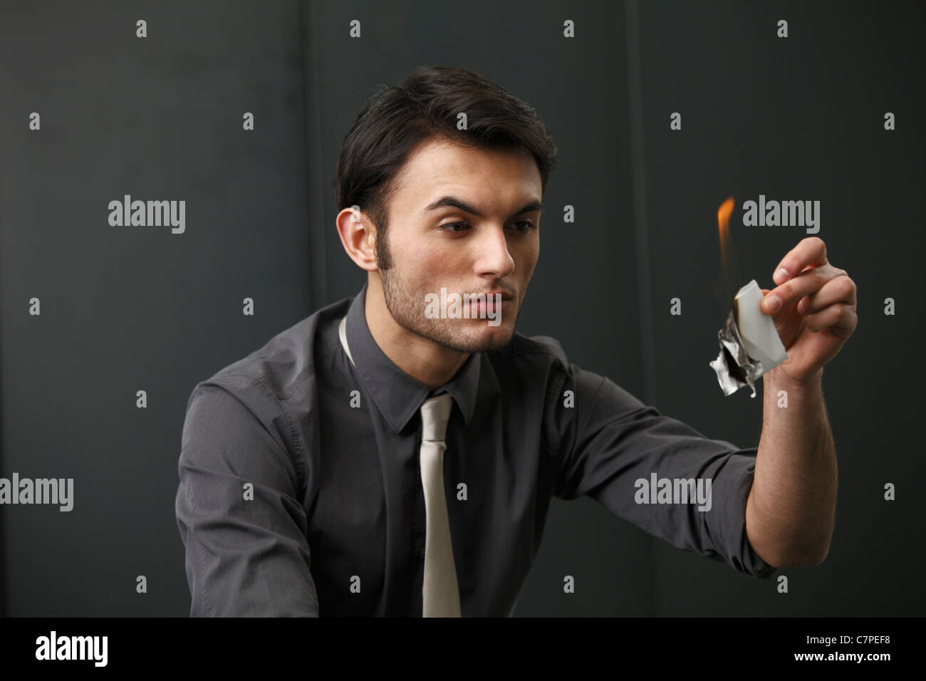 Businessman burning paper Stock Photo - Alamy Businessman burning paper Stock Photo - Alamy