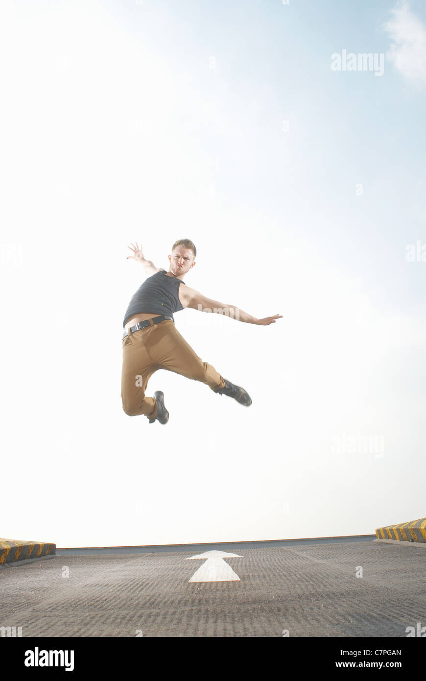 Back view young man jumping air hi-res stock photography and images - Alamy