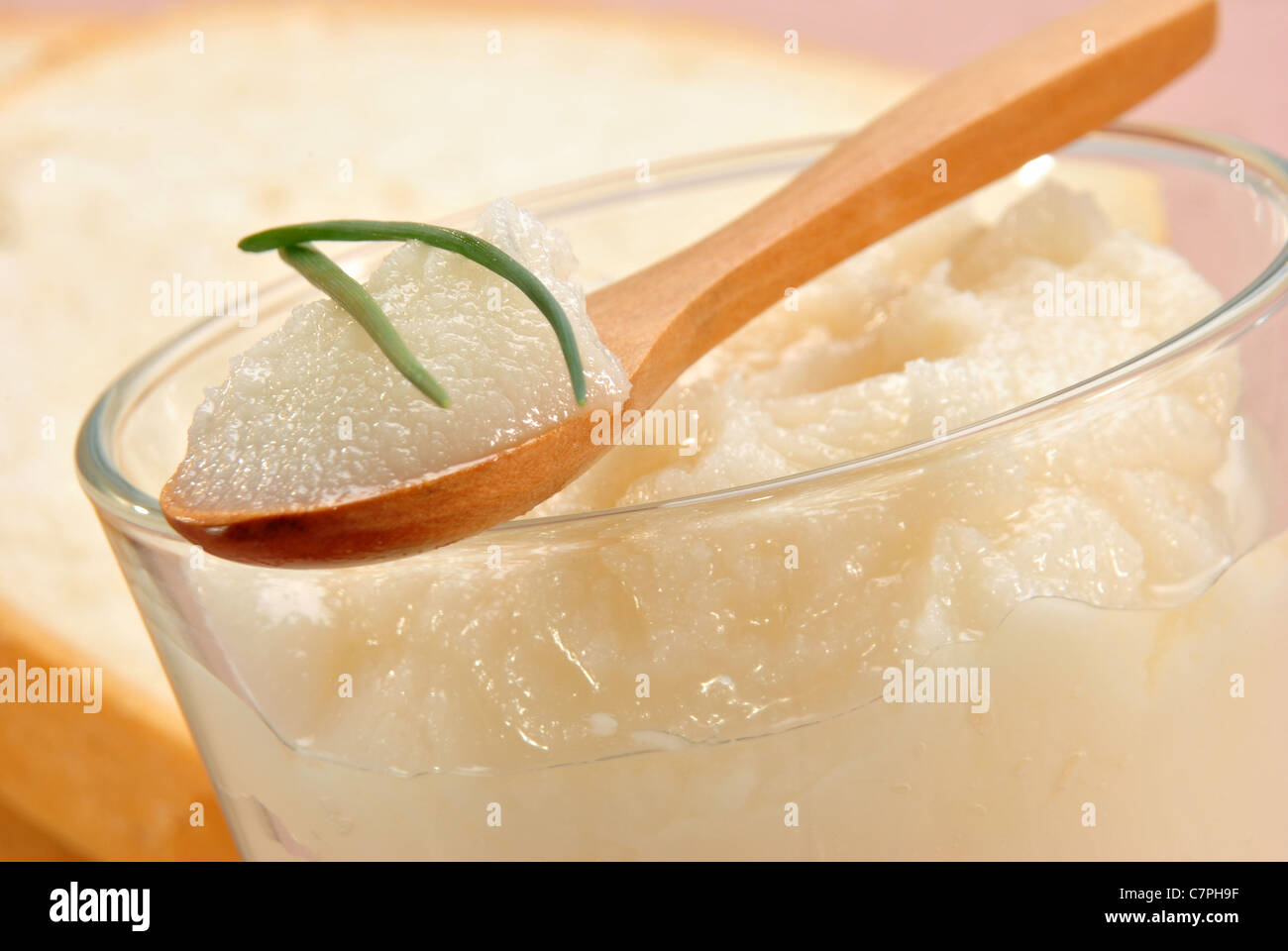 Goose fat on a small wooden spoon Stock Photo - Alamy