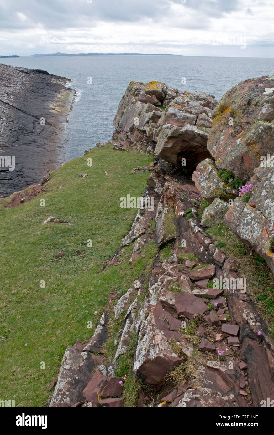 Impressive rock formations on Scotland's north west coast between ...
