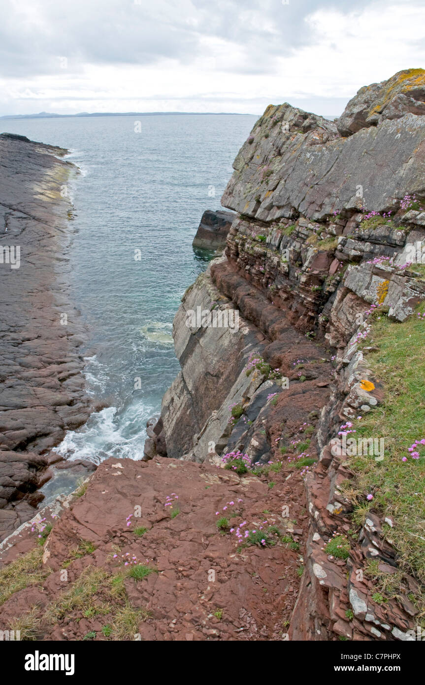 Impressive rock formations on Scotland's north west coast between ...
