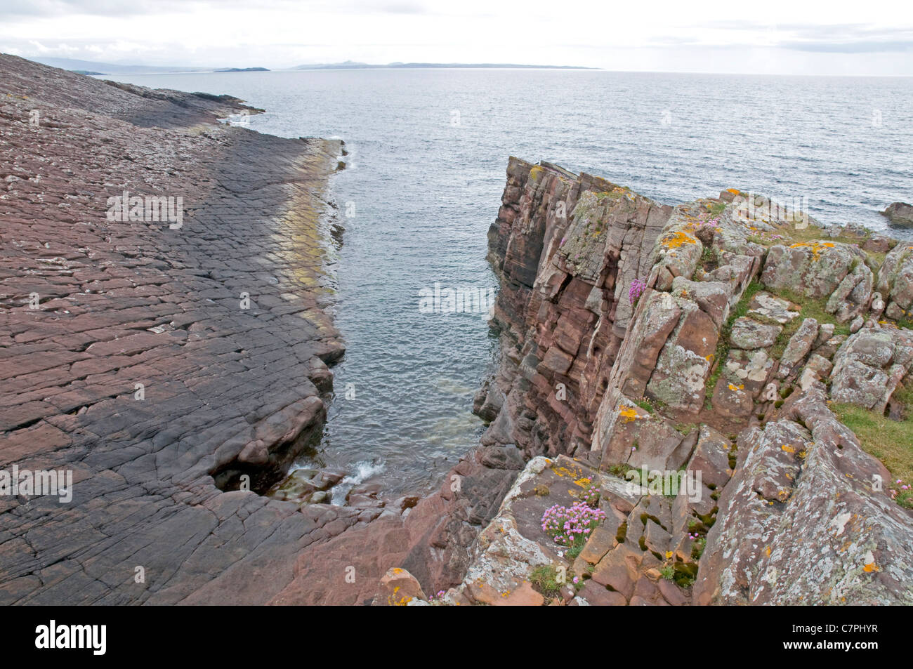 Impressive rock formations on Scotland's north west coast between ...