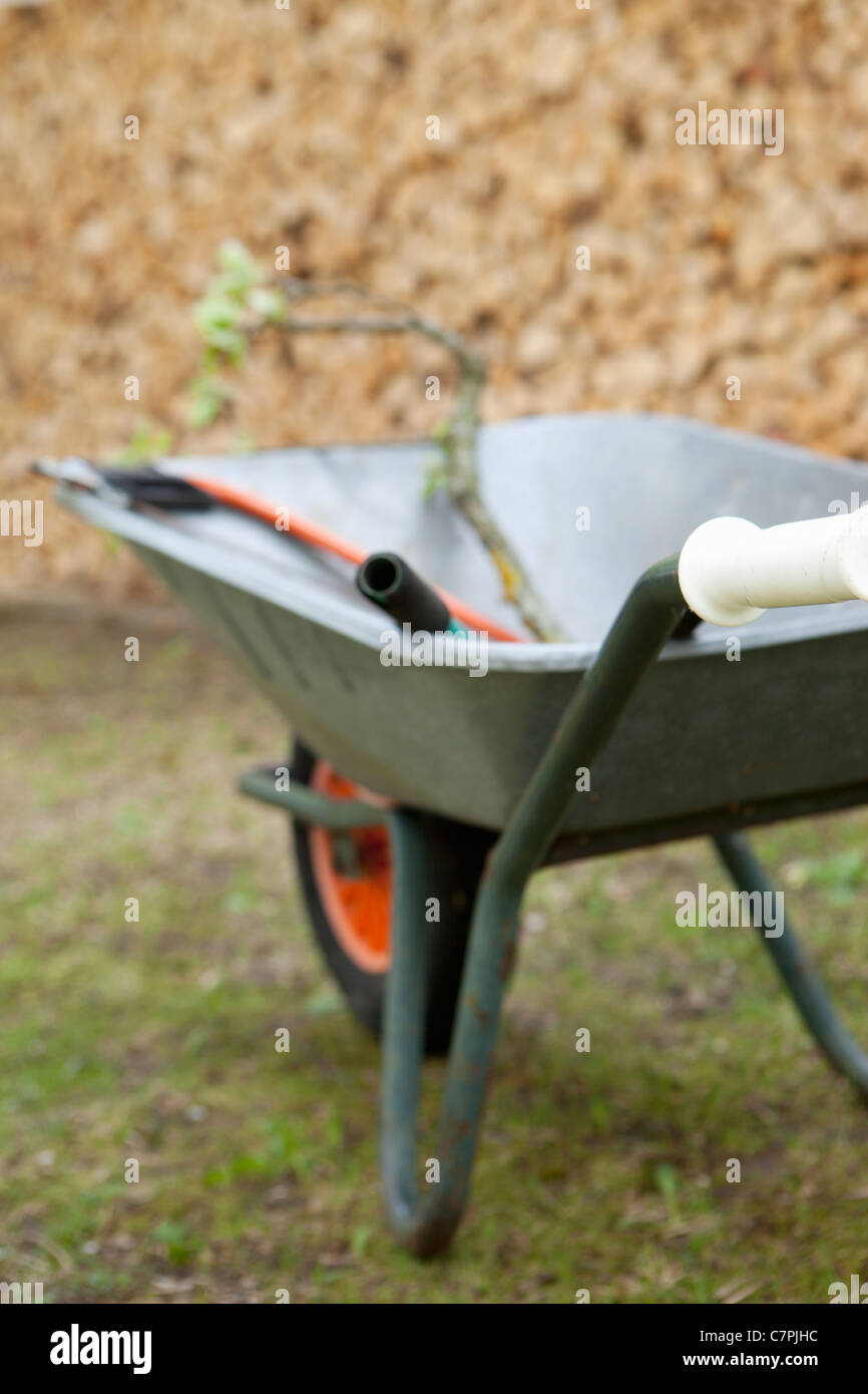Wheelbarrow with tools Stock Photo - Alamy