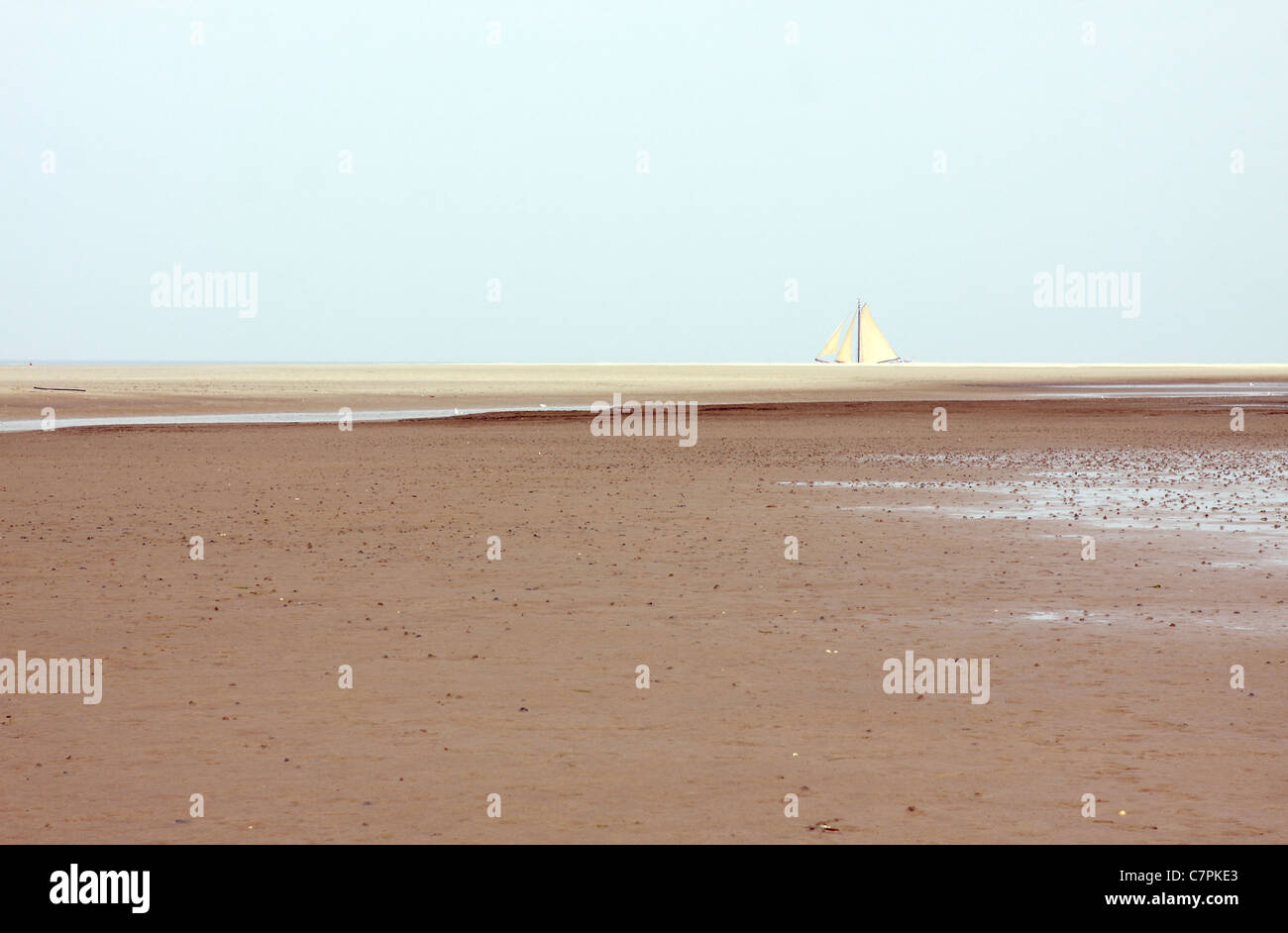 sailing ship on the sand over sky Stock Photo - Alamy