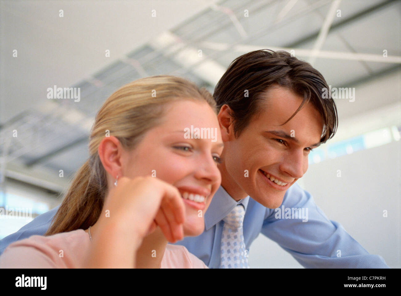 Smiling business people working together Stock Photo - Alamy