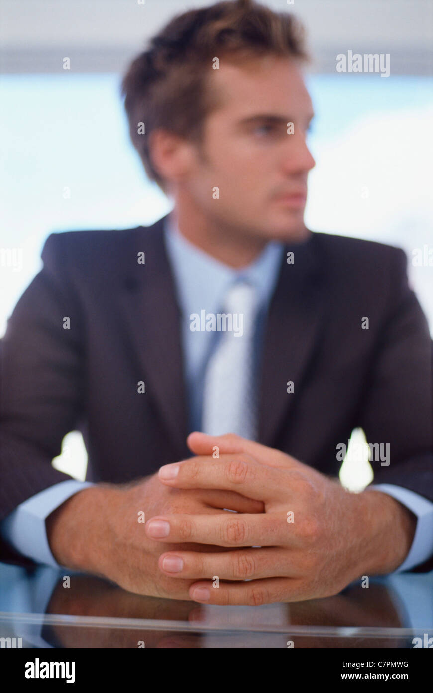Suit desk man folded hands hi-res stock photography and images - Alamy