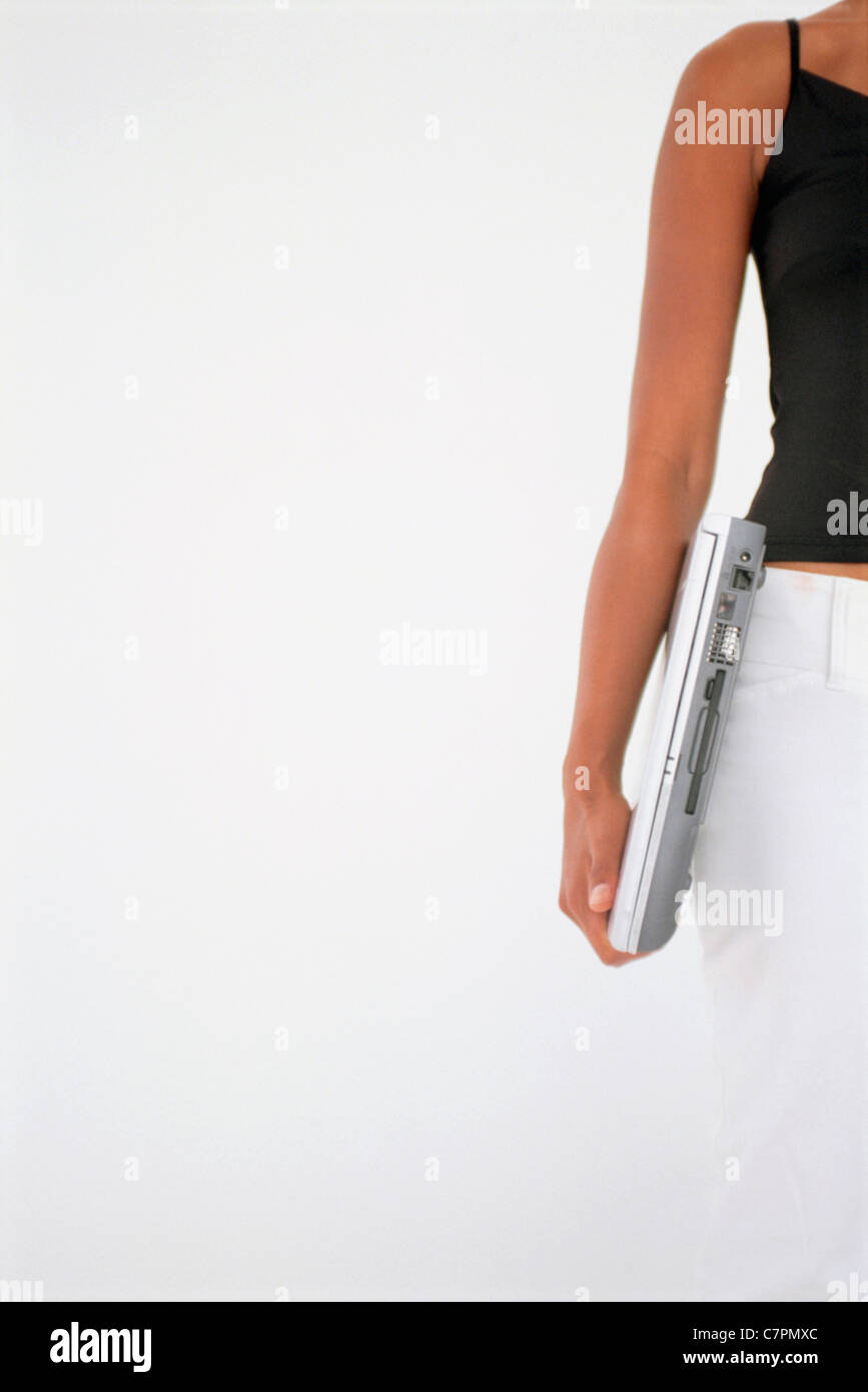 Woman carrying laptop Stock Photo - Alamy