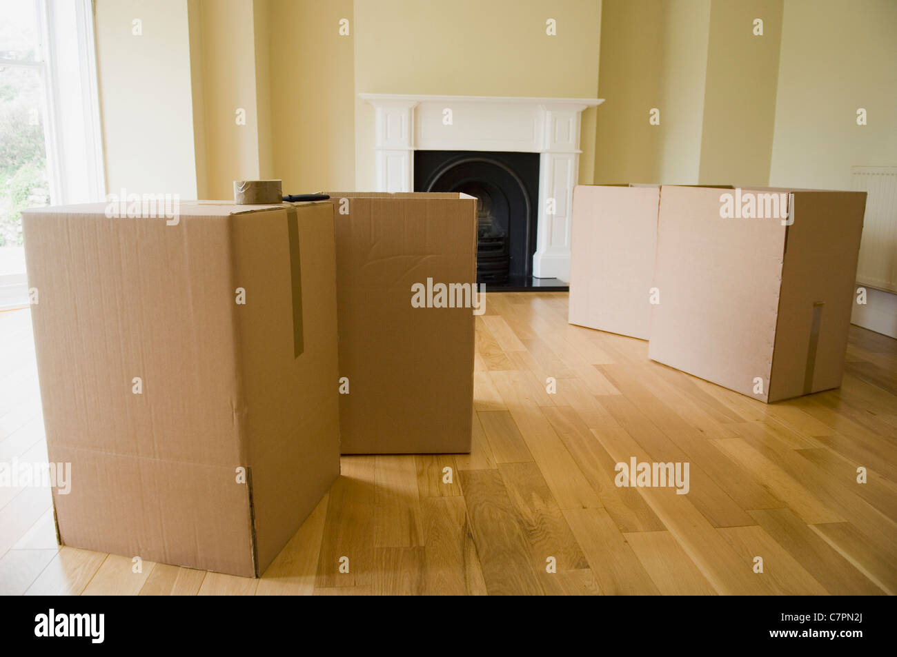 Cardboard boxes in new home Stock Photo - Alamy